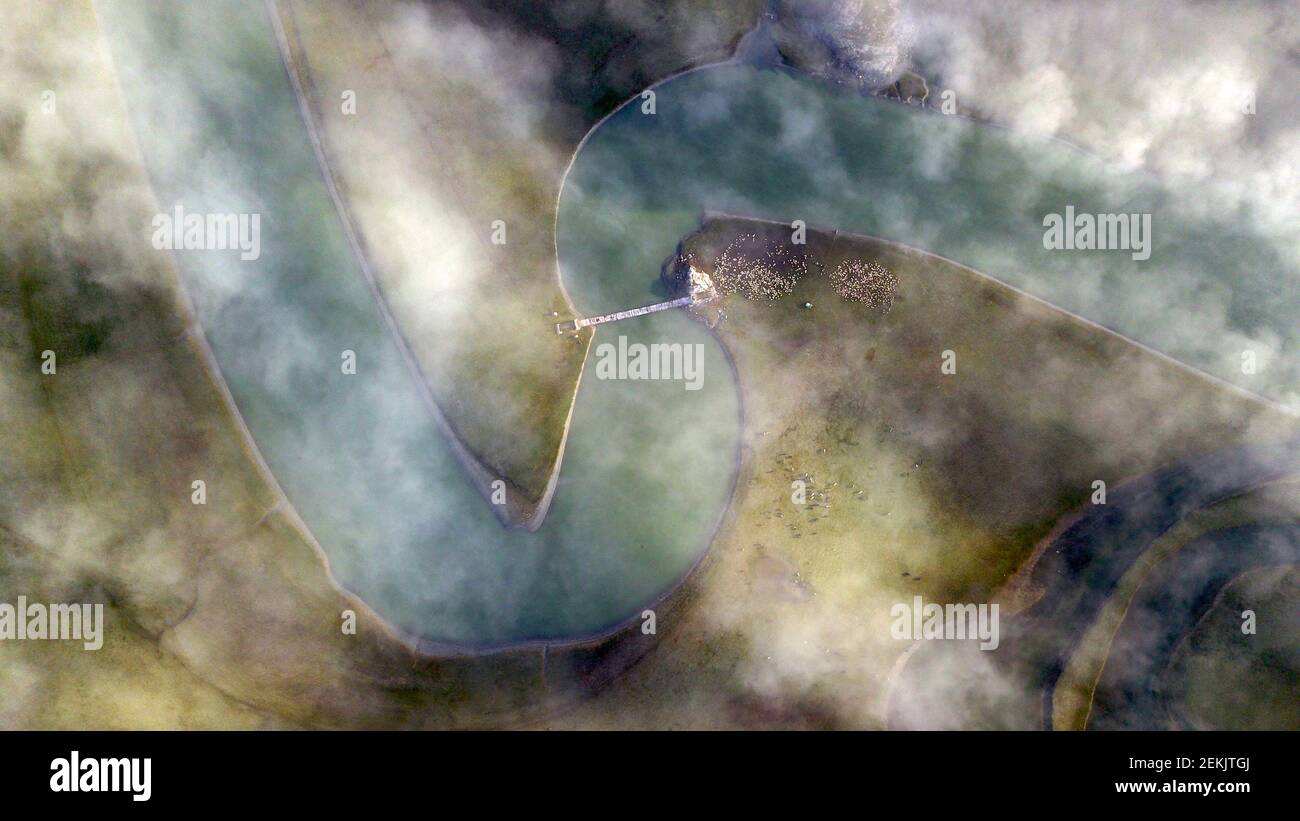 The beautiful advection fog above the Bayanbulak Grassland in ...