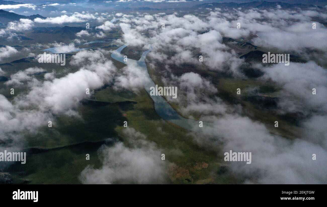 The beautiful advection fog above the Bayanbulak Grassland in ...