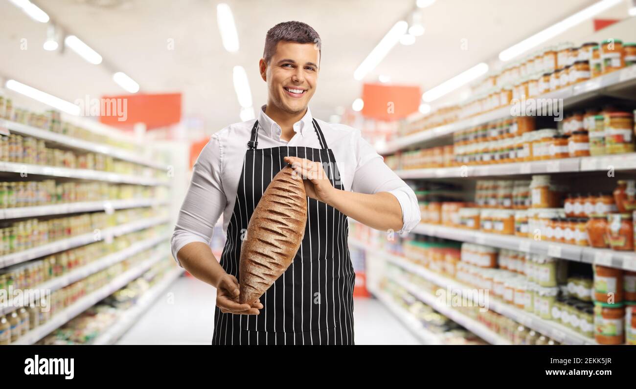 Brown male shop assistant hi-res stock photography and images - Alamy