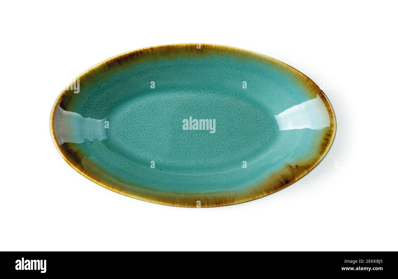 Top view of oblong turquoise ceramic plate isolated on a white ...