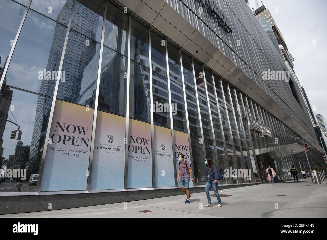 September 18, 2020: Pedestrians wearing PPE masks walk past The Now ...