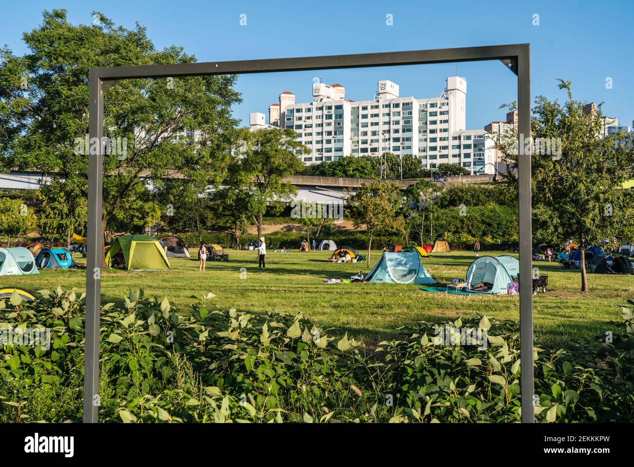 People are seen relaxing inside their camping tents at Jamwon Hangang ...