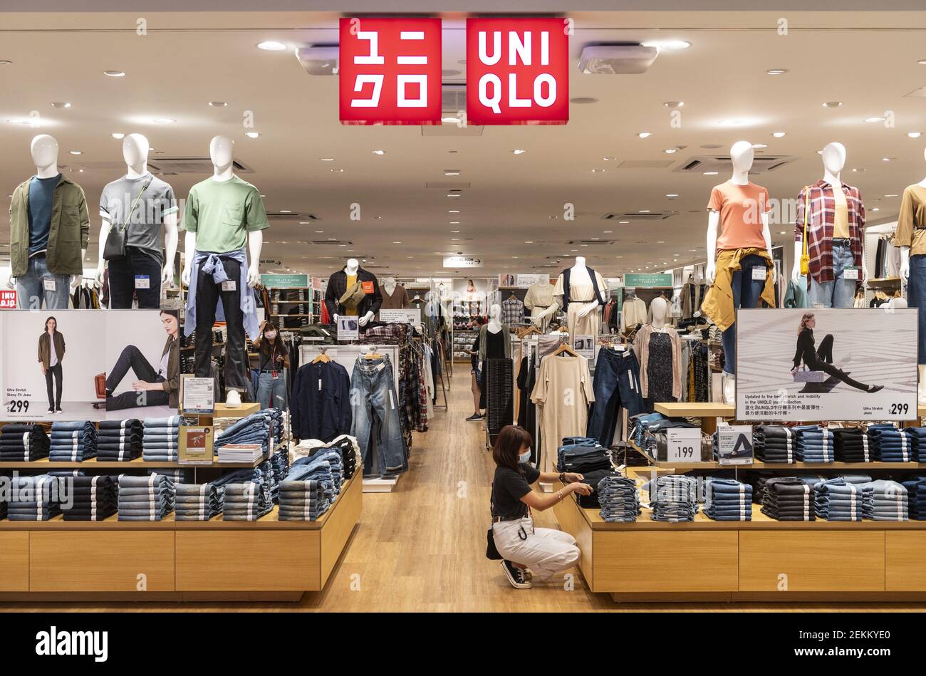 Japanese clothing brand Uniqlo logo and store in Hong Kong. (Photo by ...