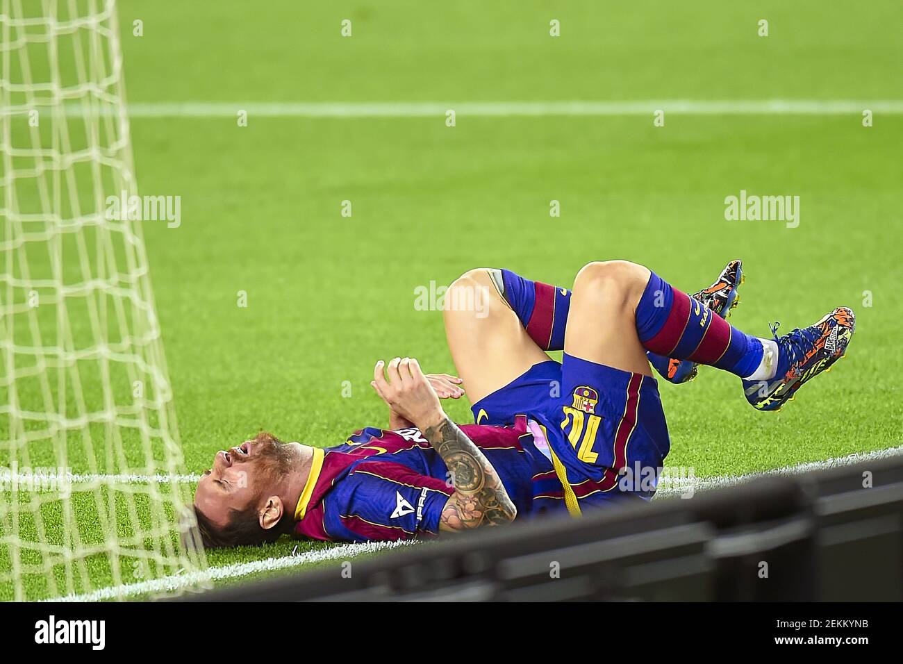 Lionel Messi of FC Barcelona injured on the floor during the Joan ...
