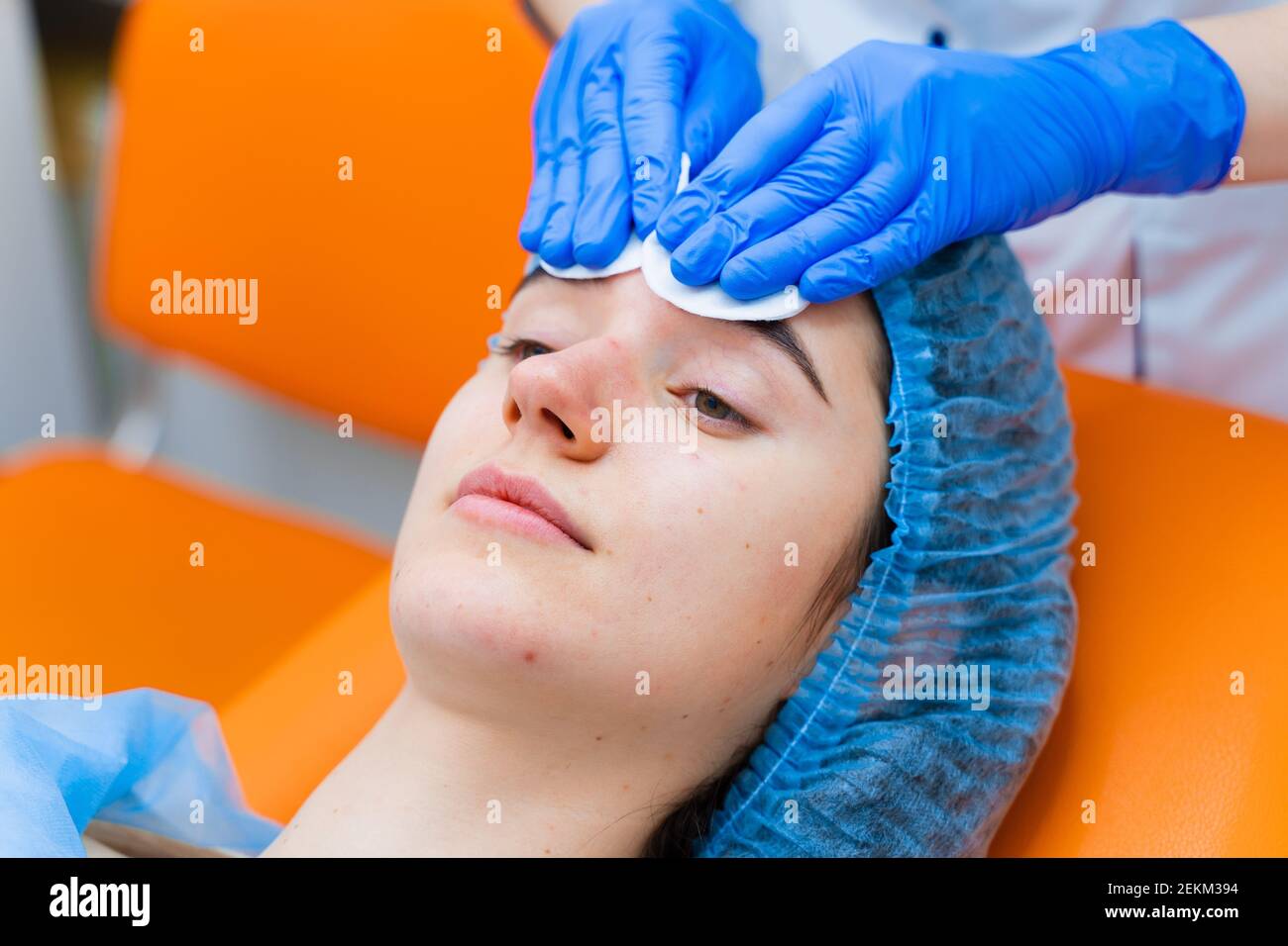 Spa procedure. Facial massage and spreading cream. Cosmetic skin care ...