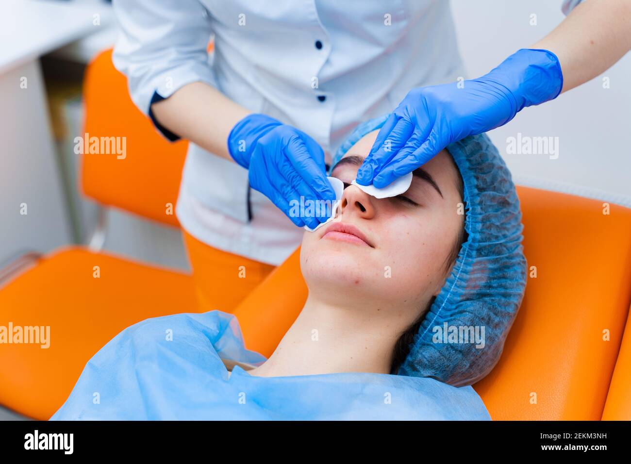 Spa procedure. Facial massage and spreading cream. Cosmetic skin care ...