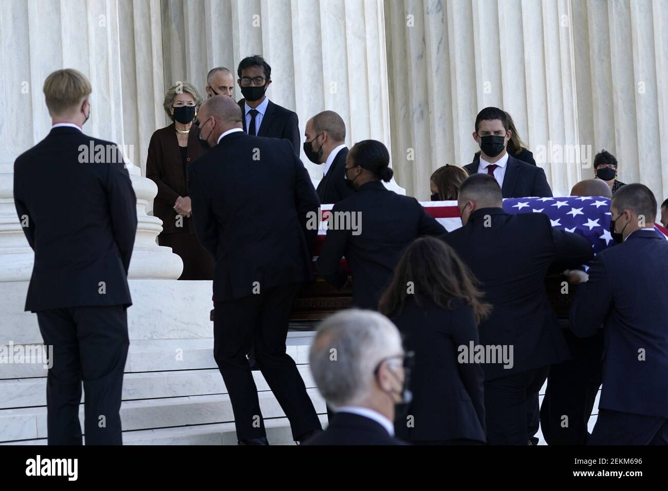 The flag-draped casket of Justice Ruth Bader Ginsburg is carried up the ...