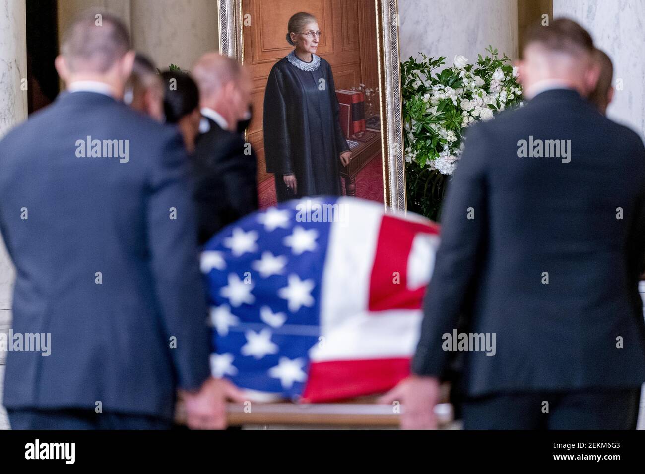 The flag-draped casket of Justice Ruth Bader Ginsburg, carried by ...