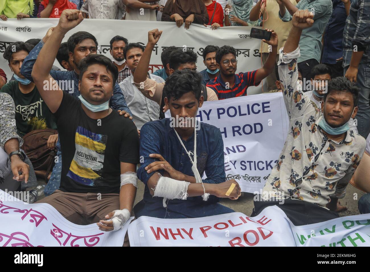 Protesters display their demonstrations banners while seated during the ...
