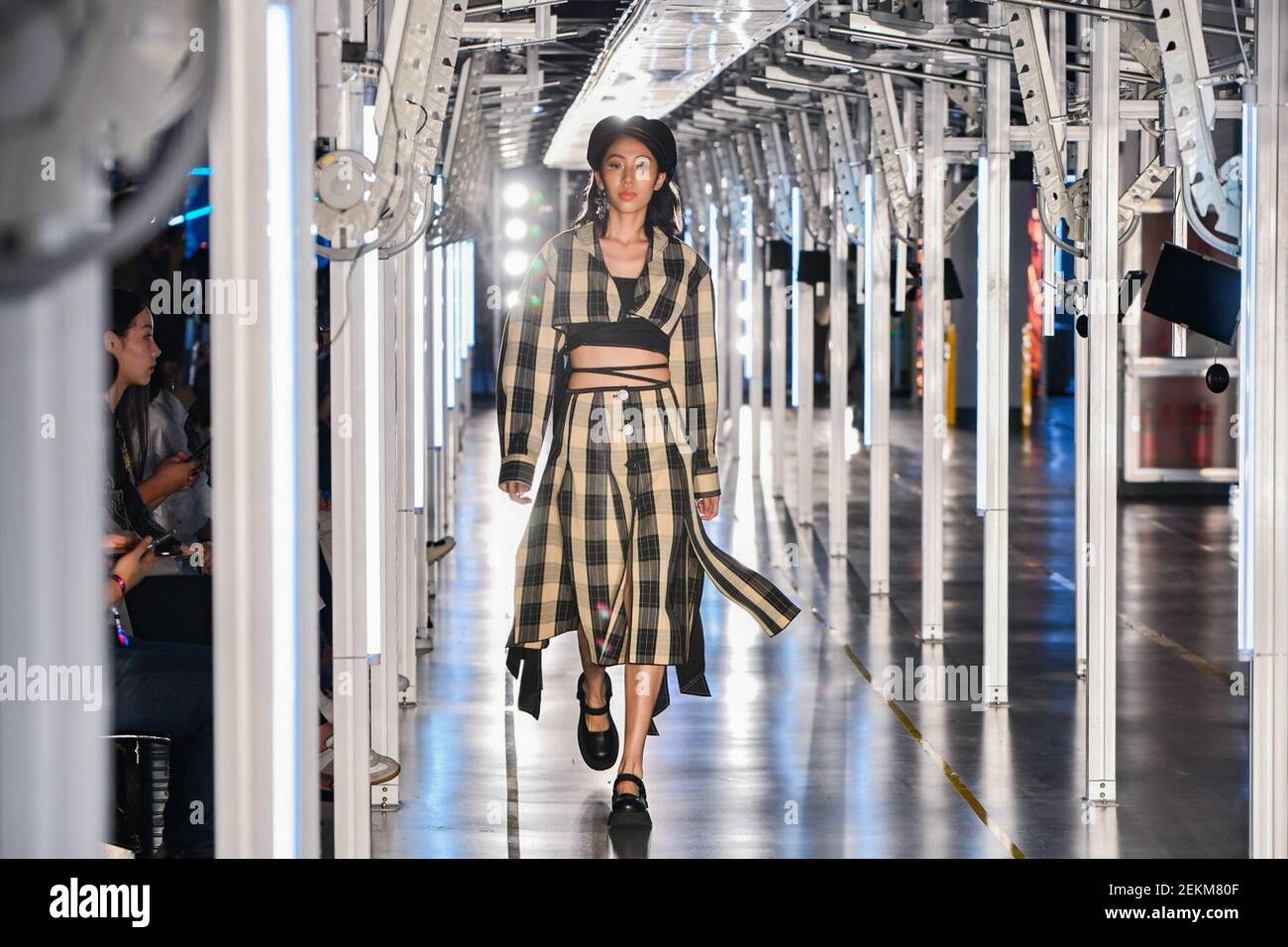 Models of Alibaba's IFashion brands cat walk on the runway set up at ...