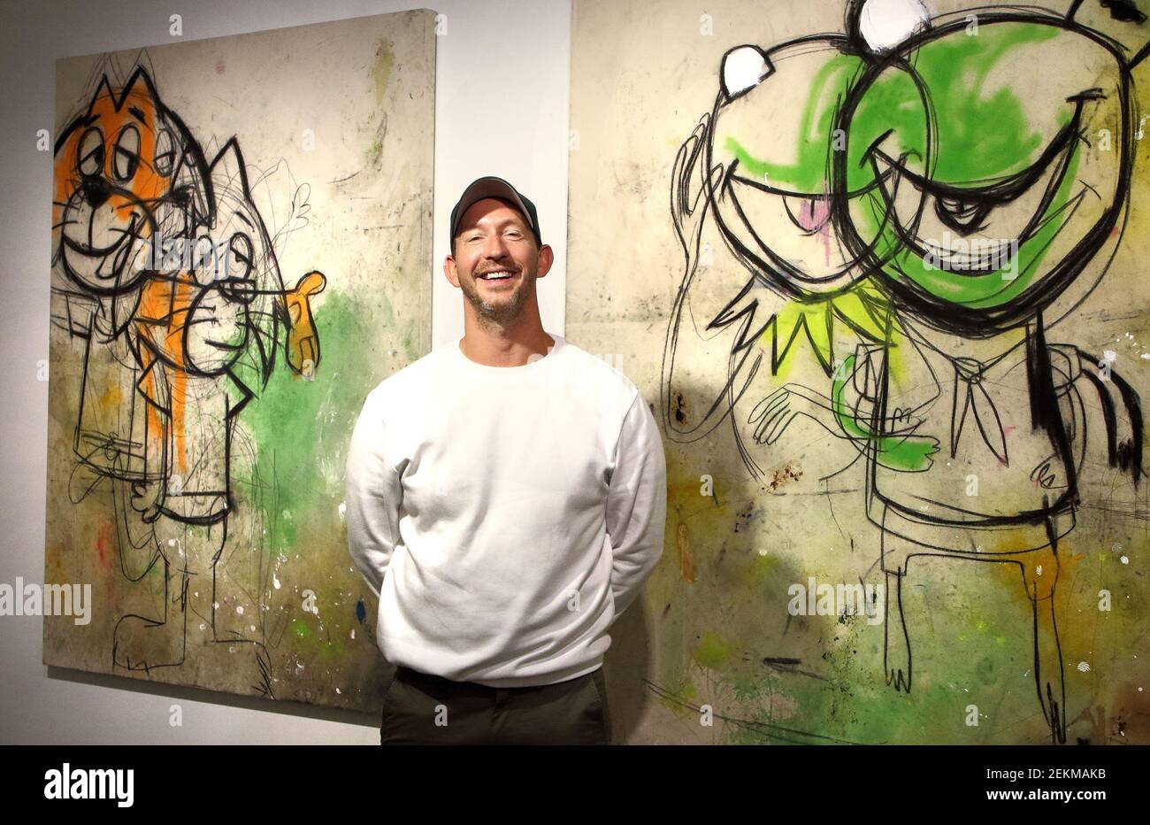 George Morton-Clark poses next to some of his work during the ...