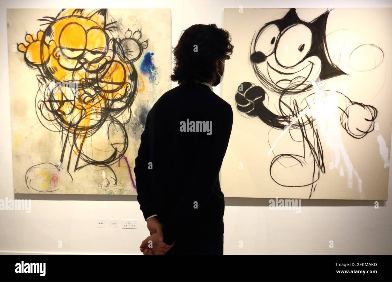 A visitor looks at George Morton-Clark's artwork during the exhibition ...