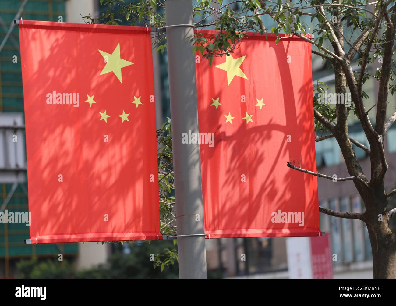 National flags of China are hung in the street light, welcoming the ...