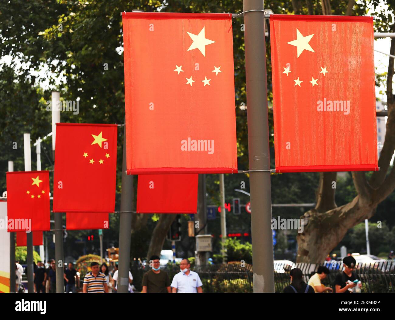 National flags of China are hung in the street light, welcoming the ...