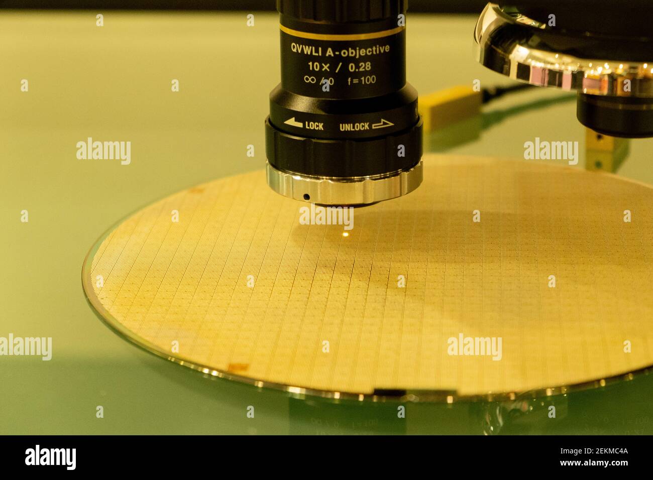 A wafer (a thin slice of semiconductor) is being inspected during the SEMICON 2020. SEMICON ...