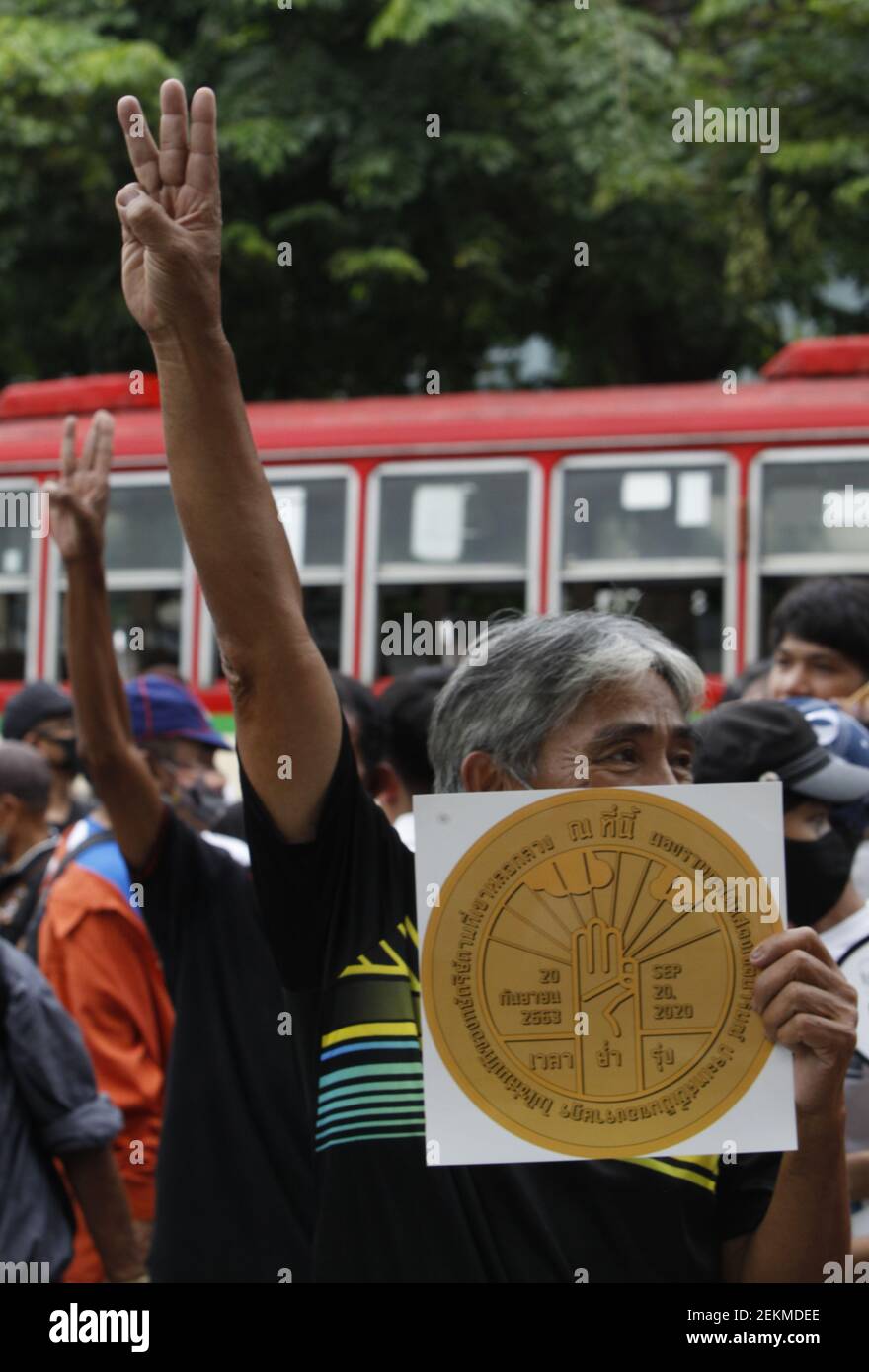An anti-government protester holds a picture of a plaque declaring ...