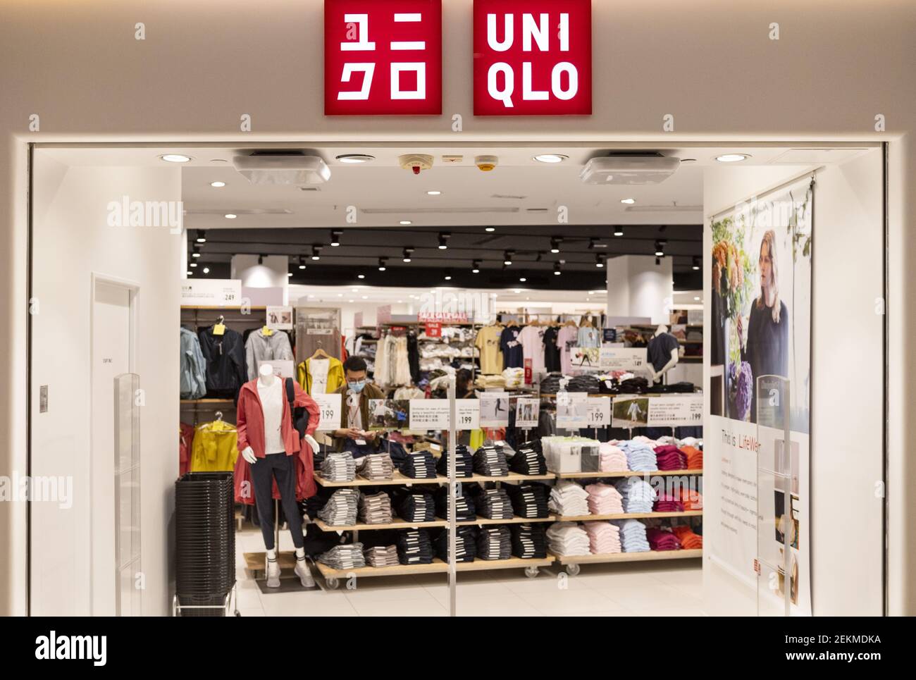 Japanese clothing brand Uniqlo logo and store in Hong Kong. (Photo by ...