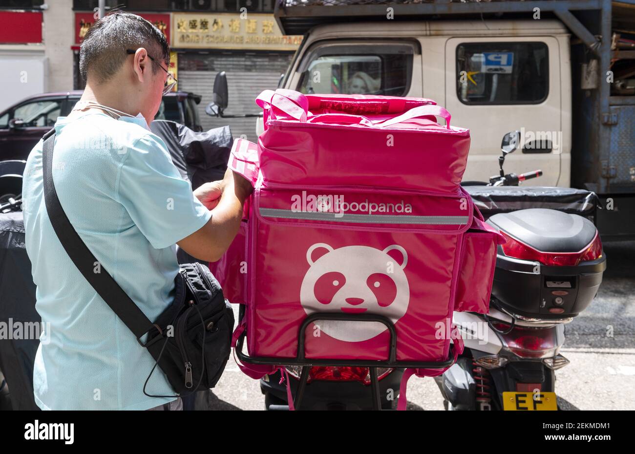 A delivery worker from a take out food delivery company Food Panda is ...