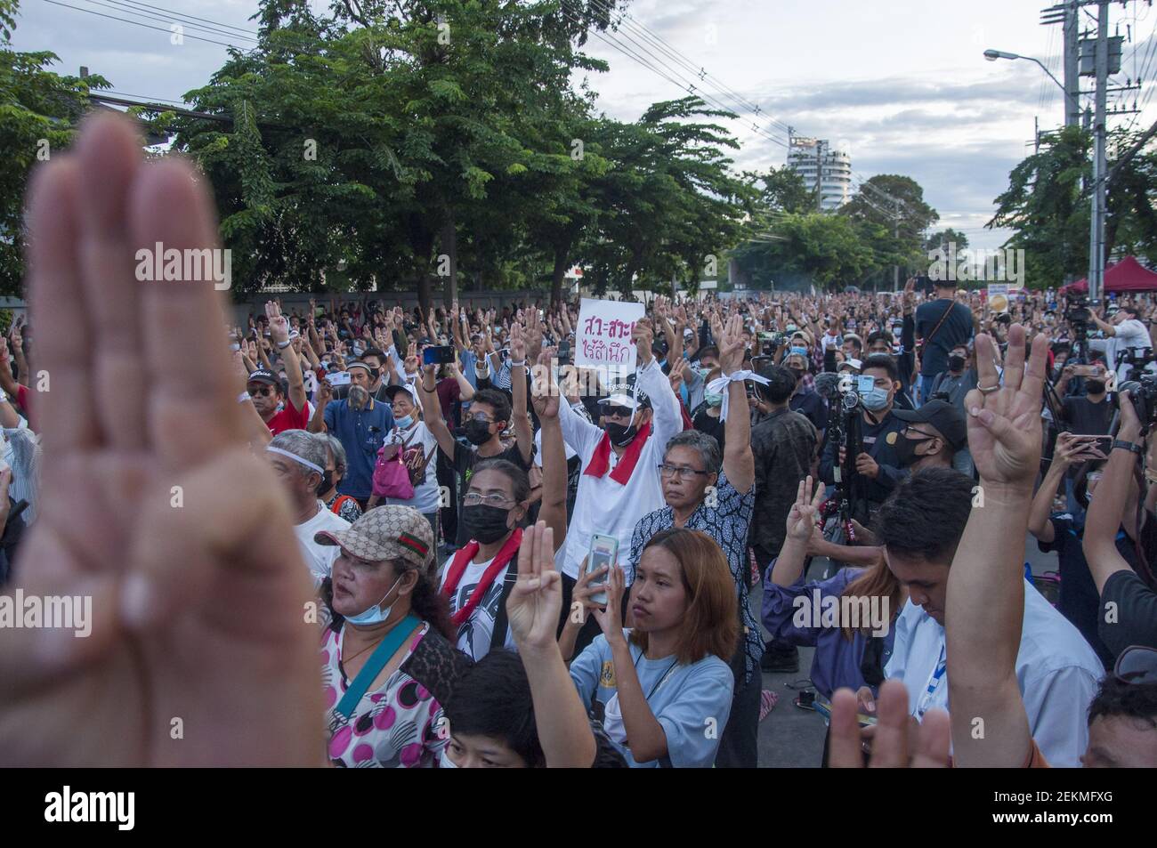 Protesters hold up the three fingers salute during the rally. Thousands ...
