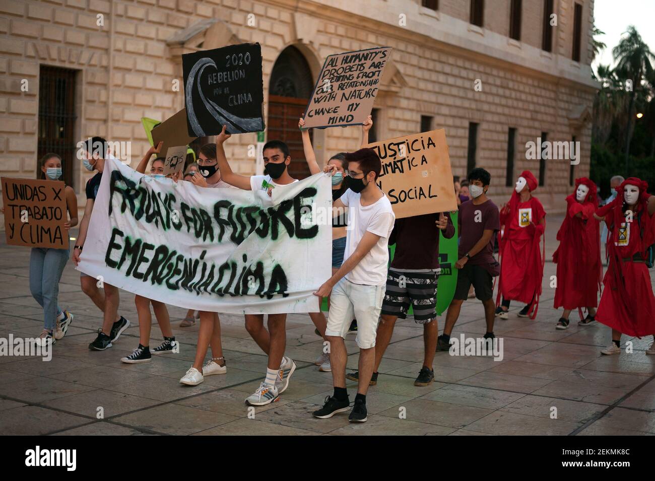 Protesters marching with a banner along the street during the ...