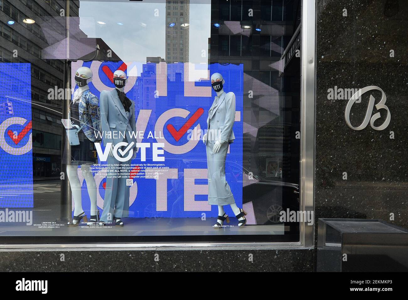Display of mannequins wearing “vote” masks and “When We All Vote” sign ...