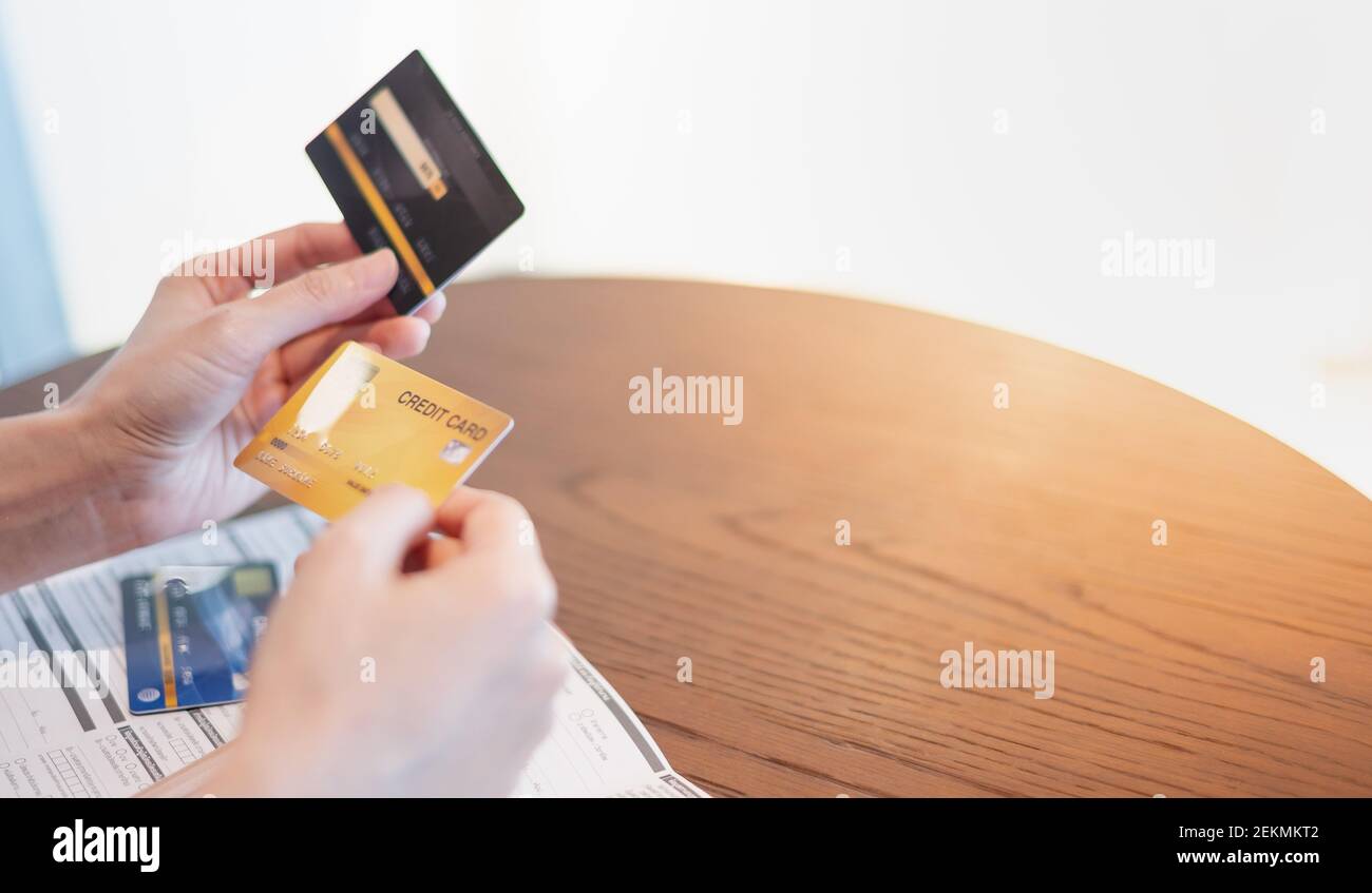The female hand holding and choosing the type of credit card after fill ...