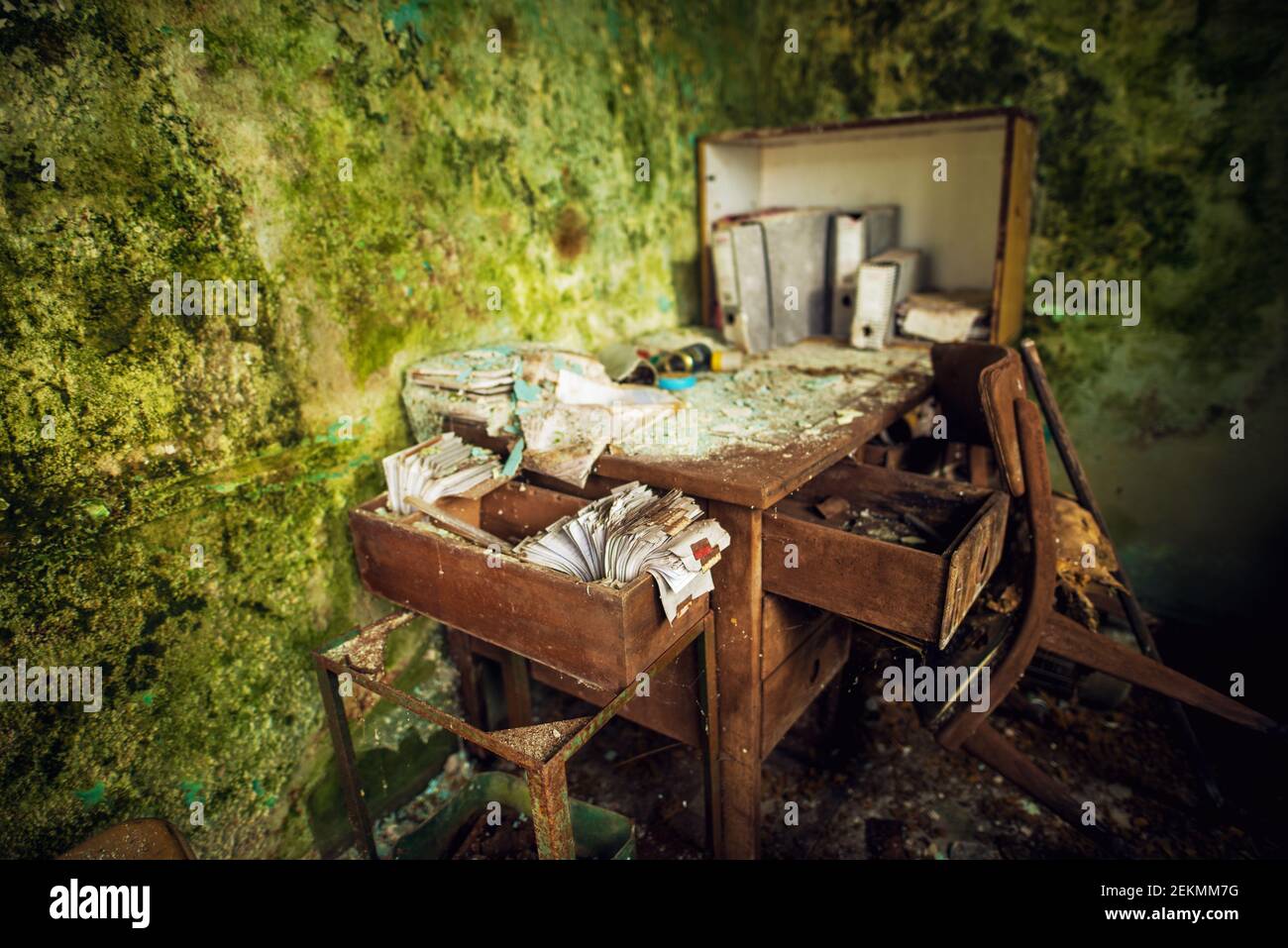 Close up focus view of ruined old forgotten damaged office desk with ...