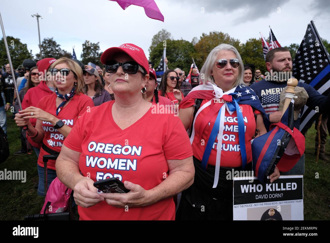 Women for Trump stand with Proud Boys as they gather in Portland, Ore ...