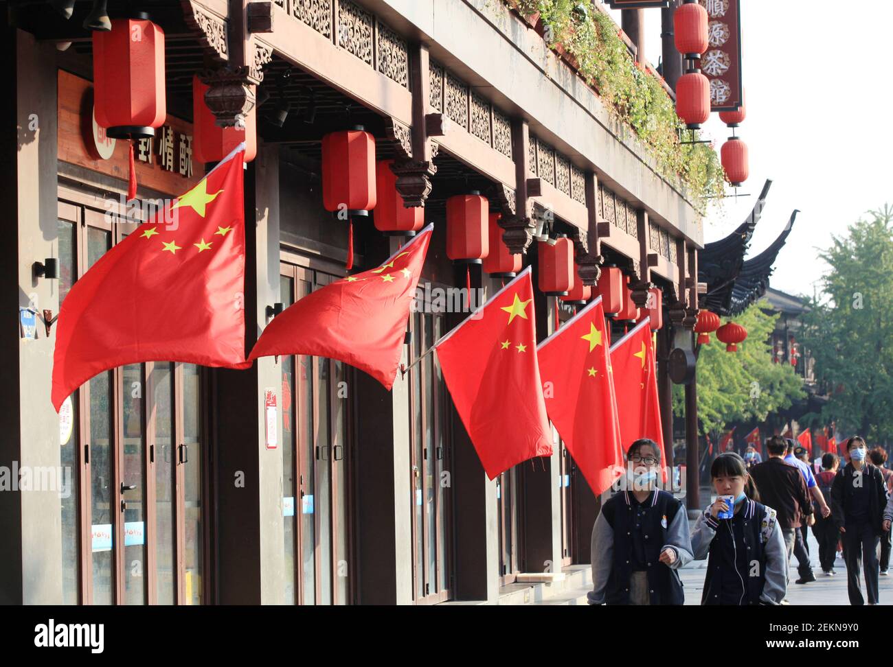 A line of Chinese national flags fly on the street prior to the ...