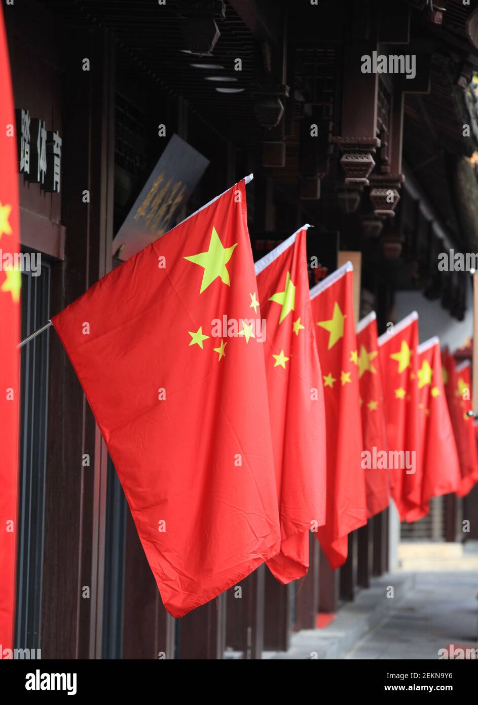 A line of Chinese national flags fly on the street prior to the ...