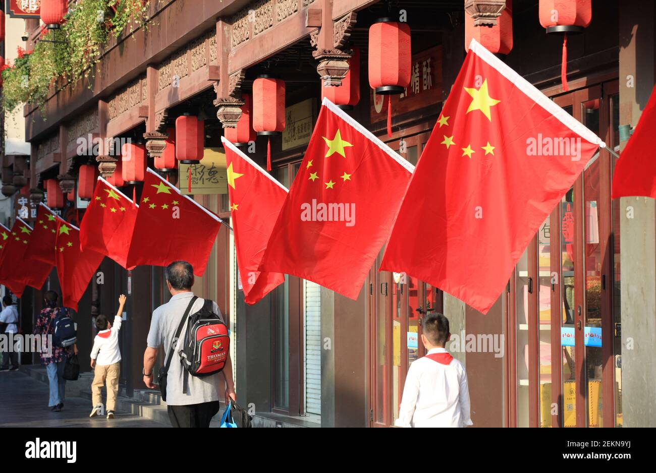 A line of Chinese national flags fly on the street prior to the ...