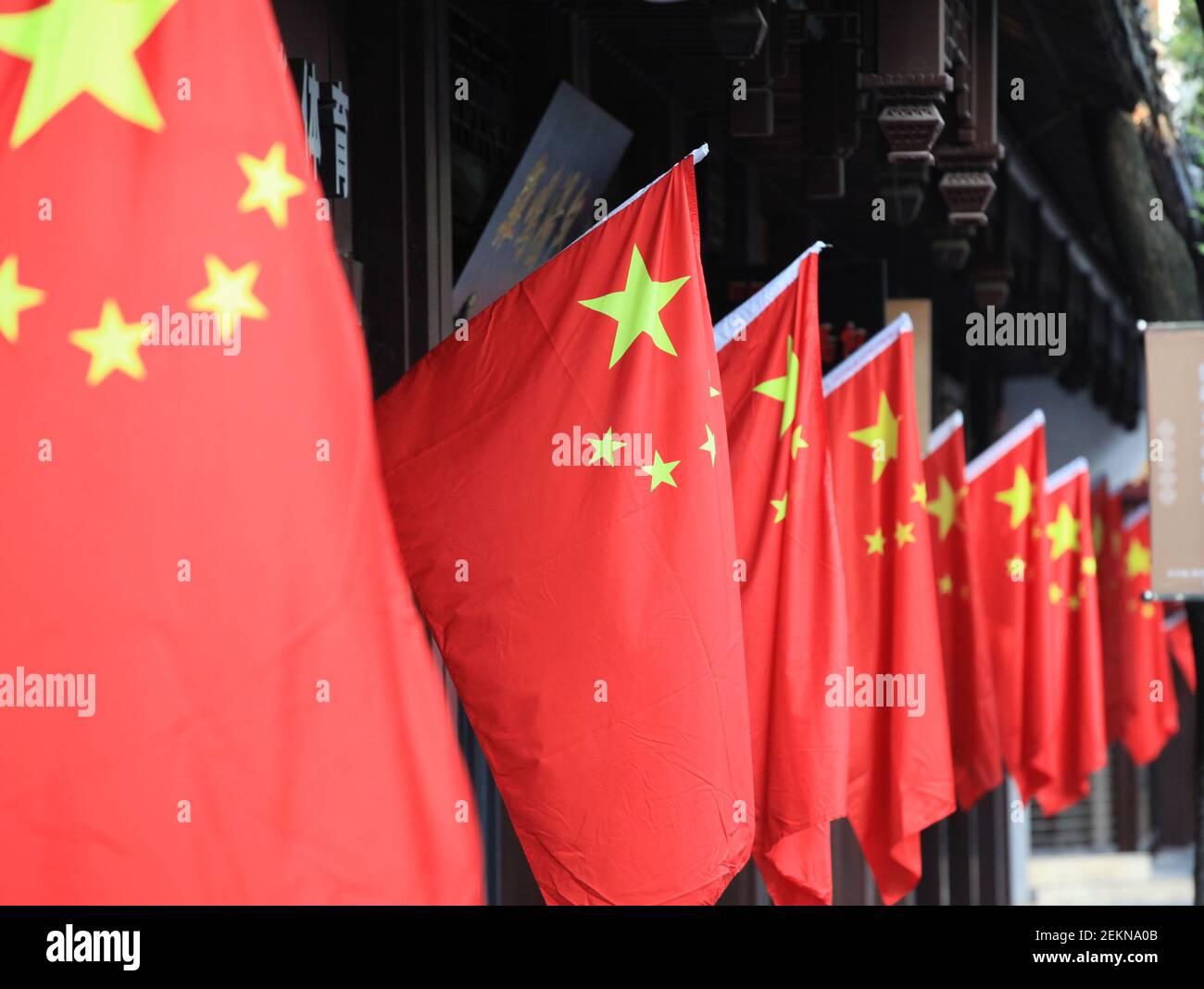 A line of Chinese national flags fly on the street prior to the ...