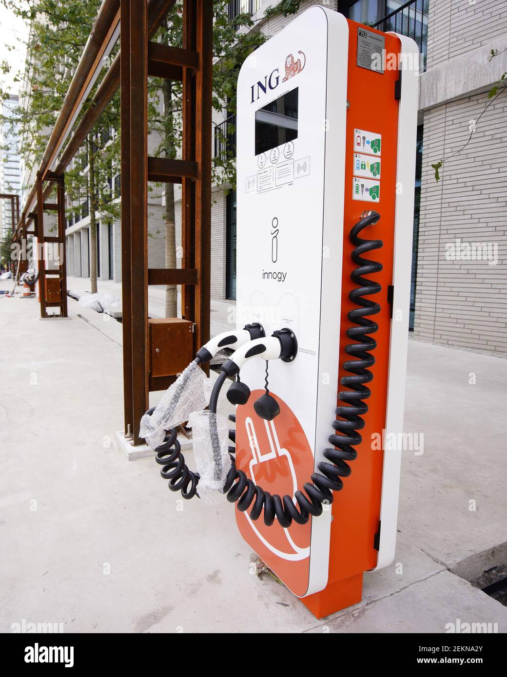 An electric car charging station is seen at a building site in Warsaw ...