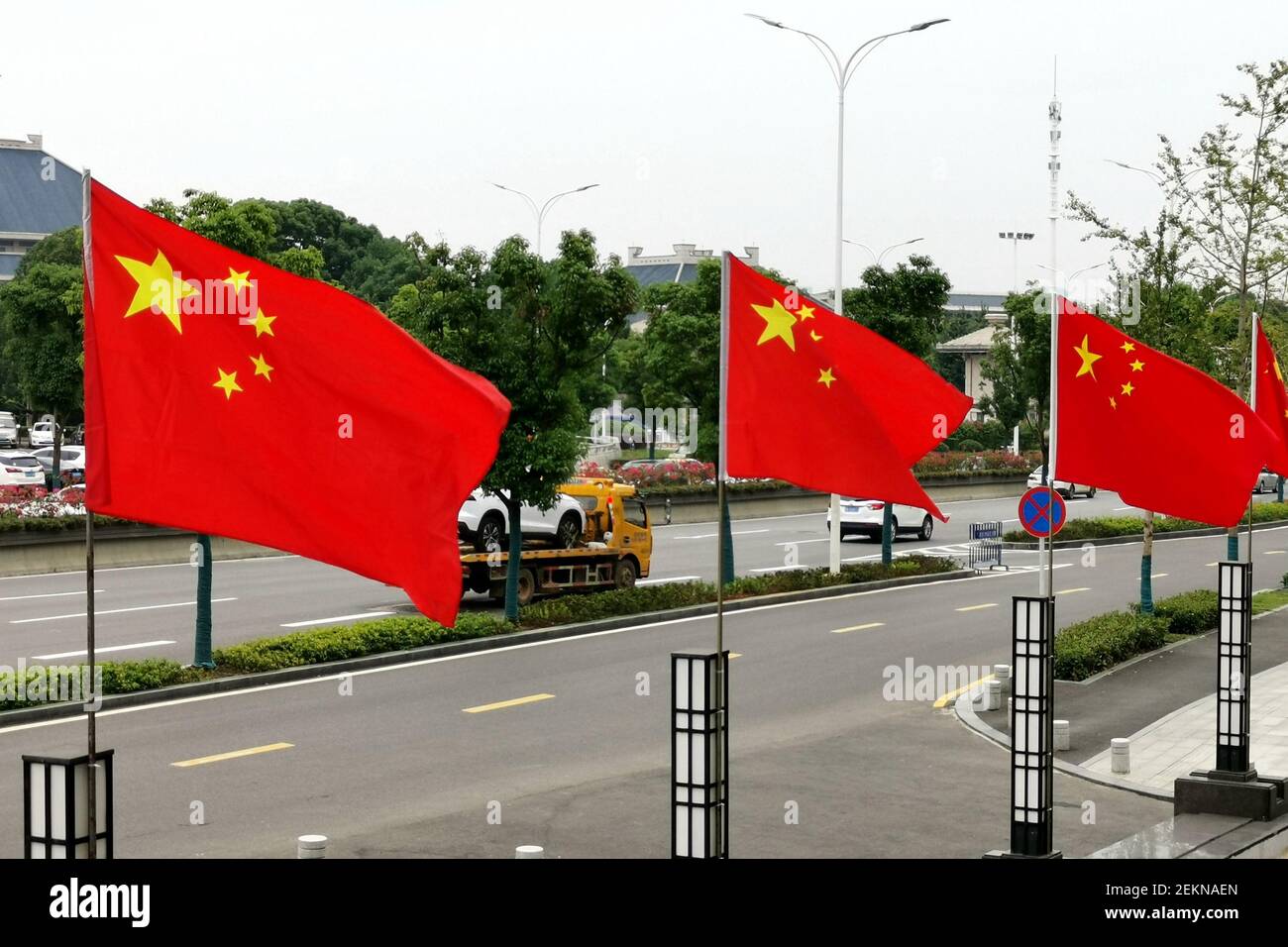 Red lanterns and national flags are seen flying along the Yihe street ...