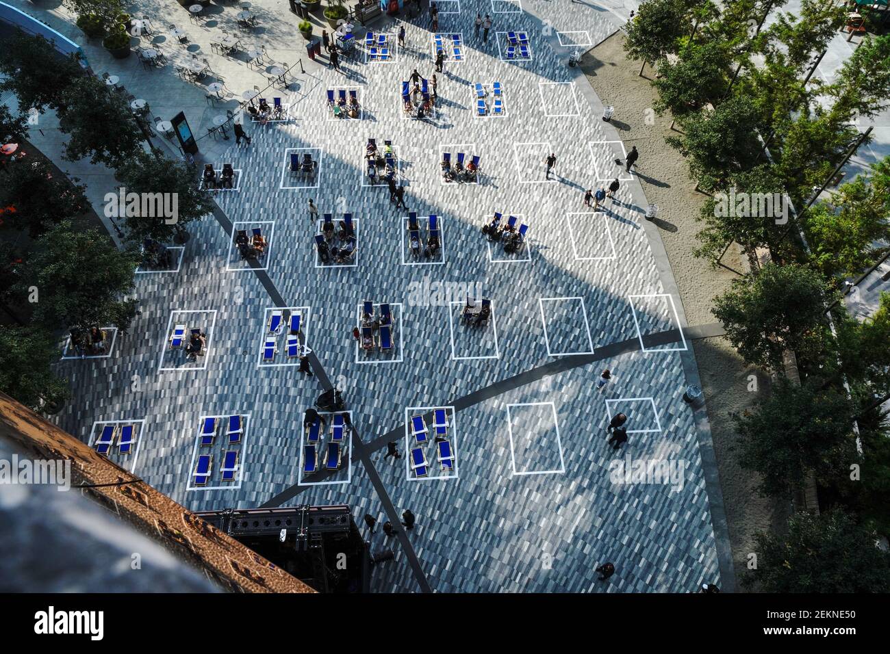 People watch the Hudson Yards’ Backyard Big Screen curated in ...