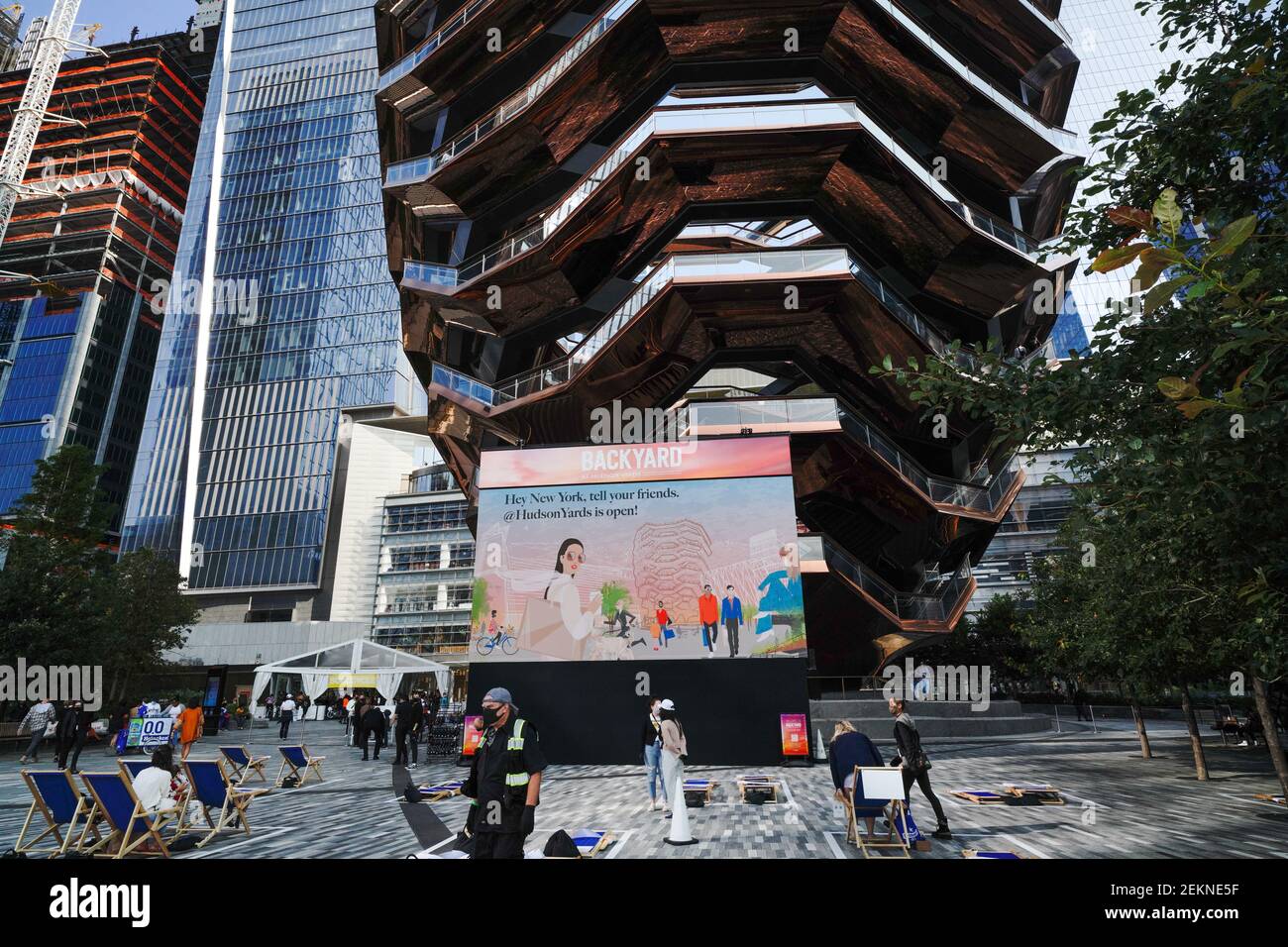 People watch the Hudson Yards’ Backyard Big Screen curated in ...