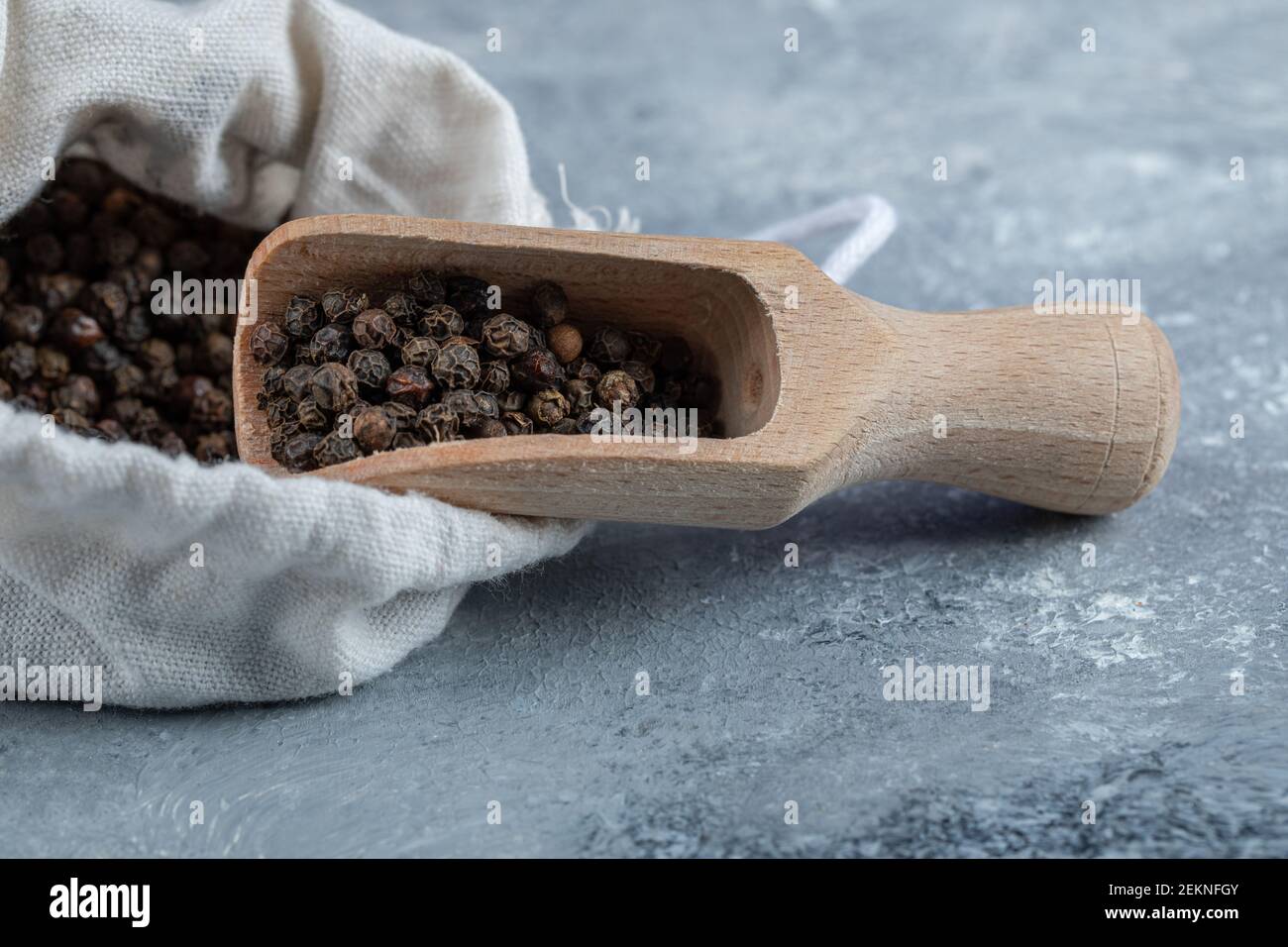 A white sack full of dried pepper on a marble background Stock Photo ...