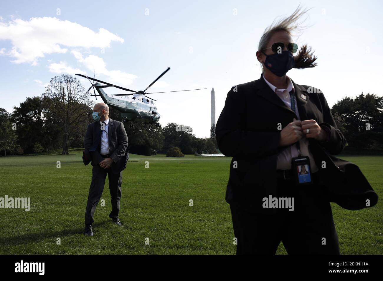 U.S. Secret Service agents stand guard as Marine One helicopter with ...