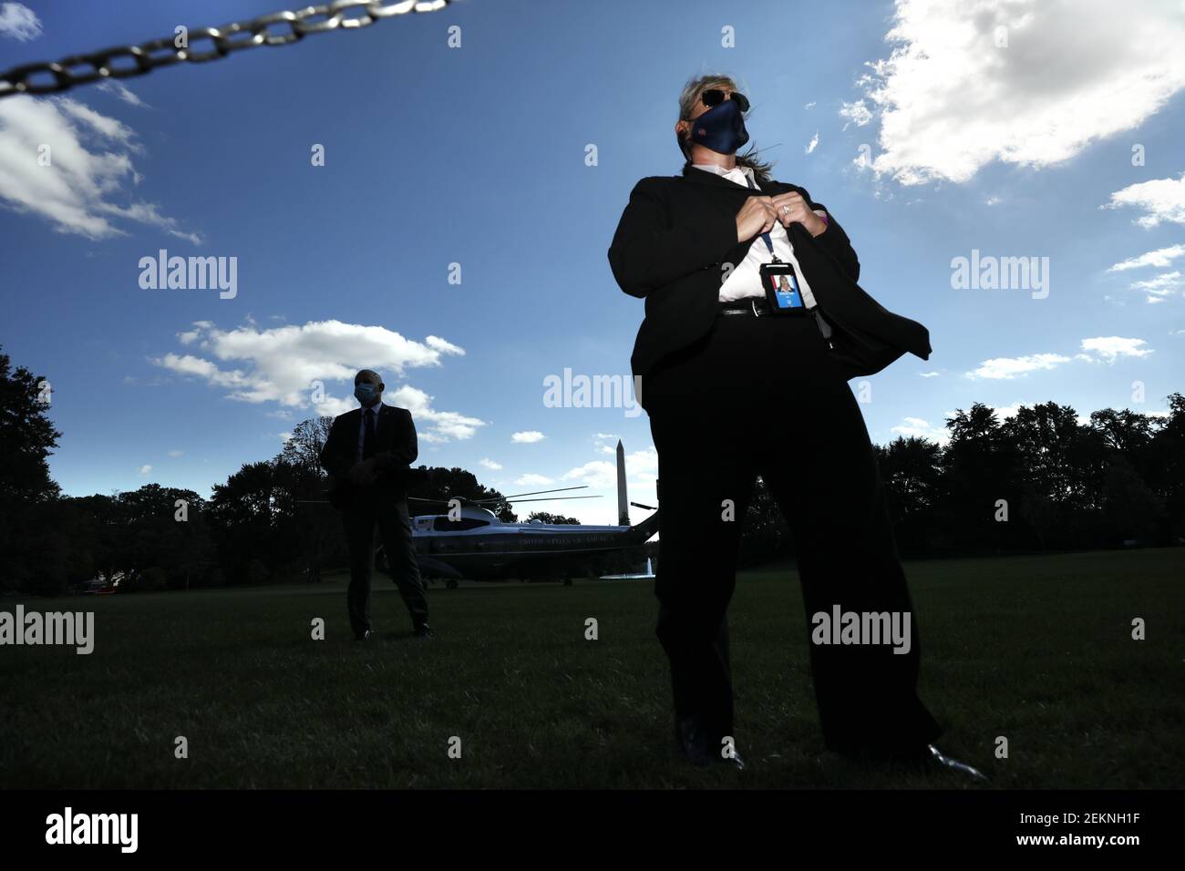 U.S. Secret Service agents stand guard as Marine One helicopter with ...