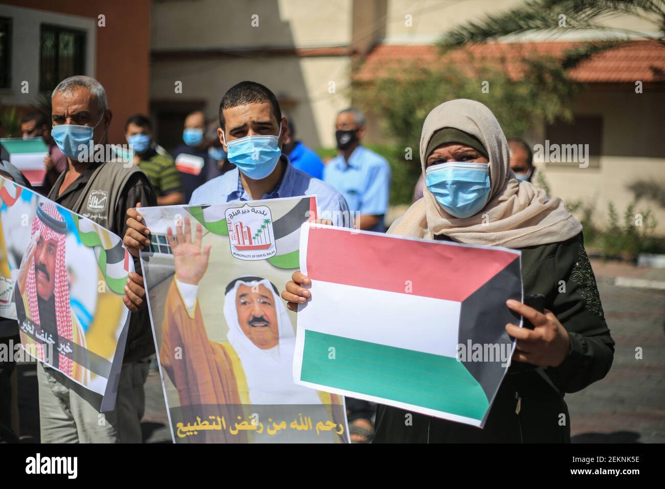 Palestinians holds banners during take part in a stand of support with ...