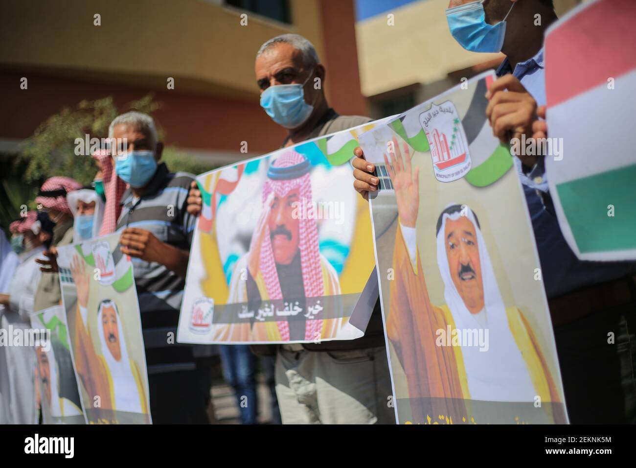 Palestinians holds banners during take part in a stand of support with ...