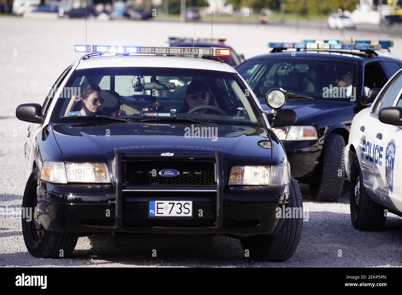 Police cars line up to start driving in the American Police Car Parade ...