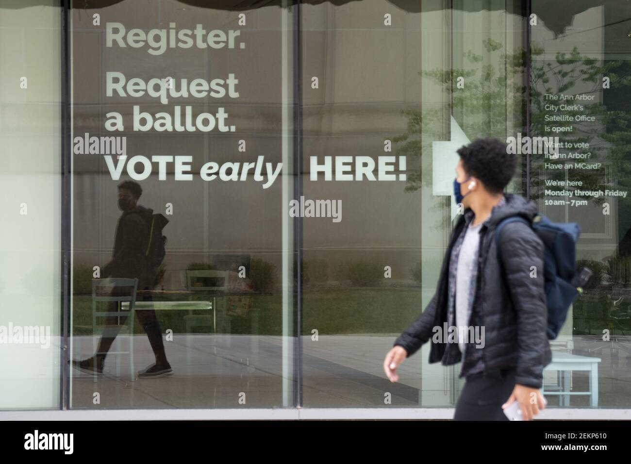 People walk past an early voting location for the 2020 general election ...
