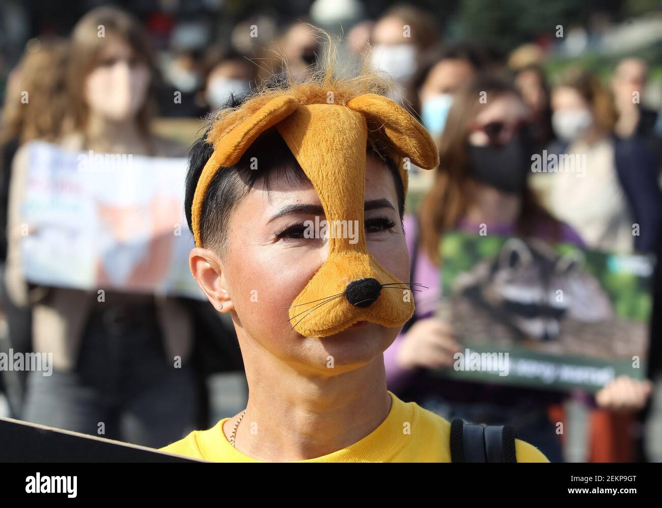 An activist wearing a dog headgear during the demonstration. At ...
