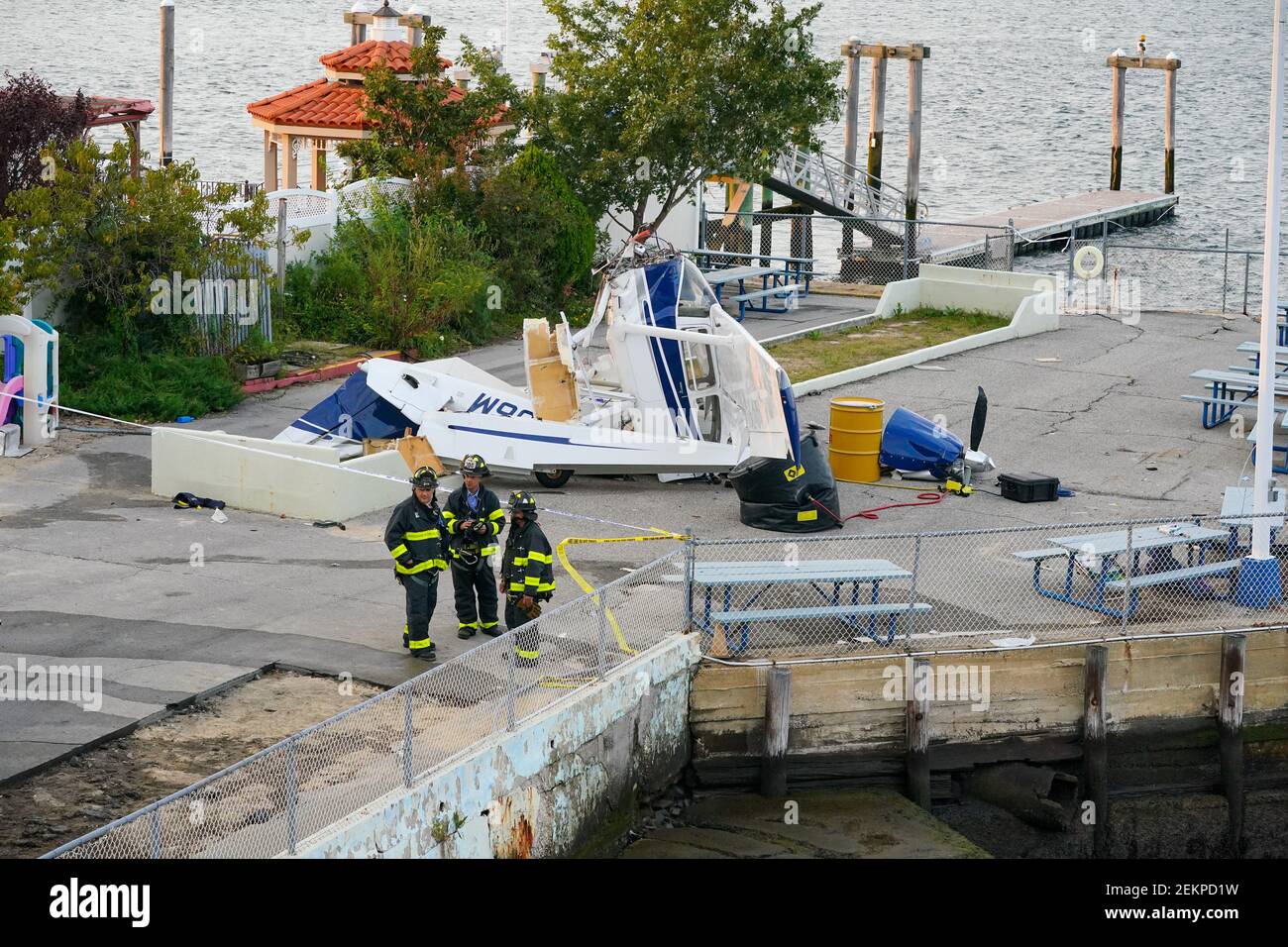 FDNY (New York City Fire Department) seen next to a small plane that ...
