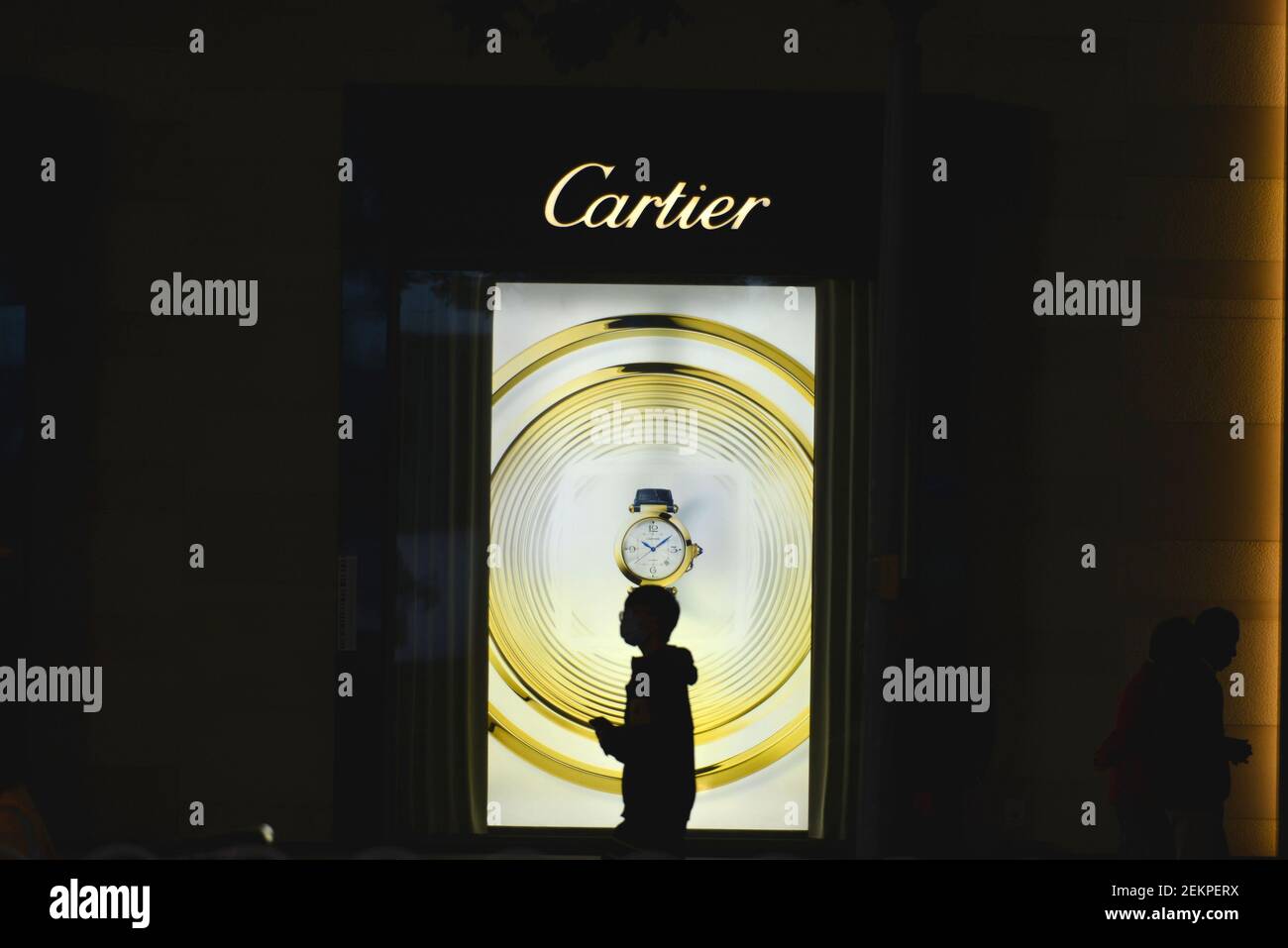 BEIJING, CHINA - OCTOBER 4, 2020 - A tourist passes by the luxury brand ...