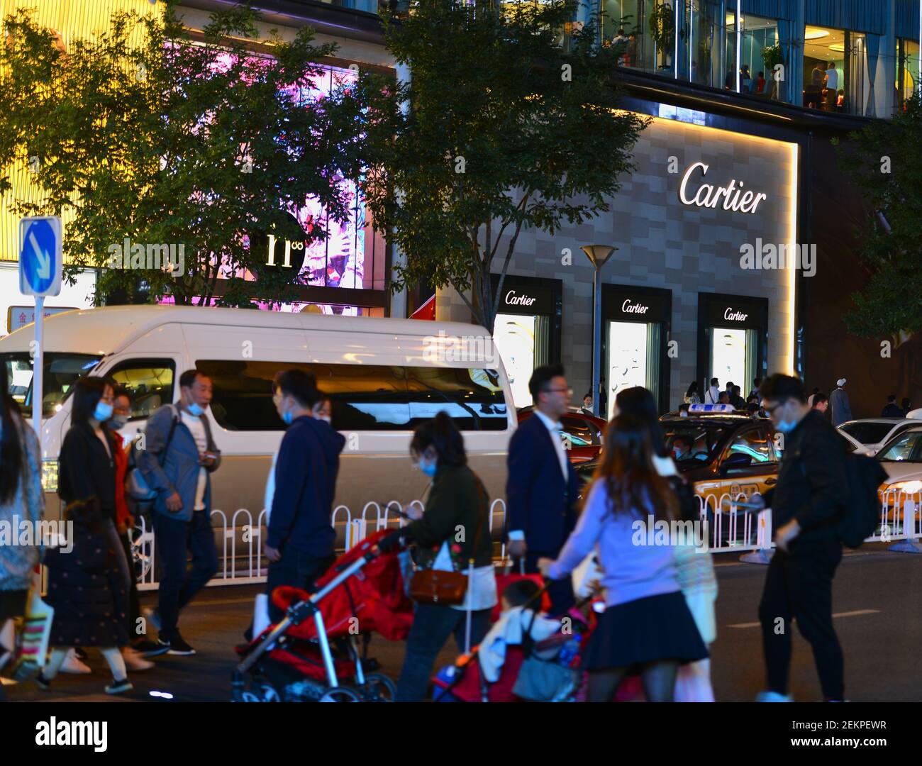 BEIJING, CHINA - OCTOBER 4, 2020 - Tourists passe by the luxury brand ...
