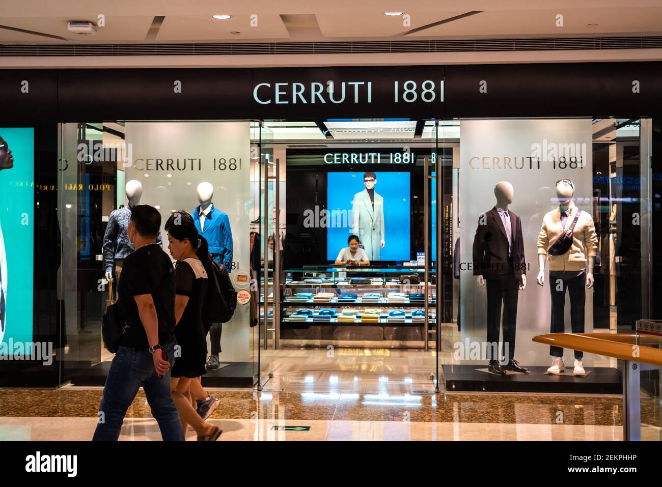 Pedestrians walk past a Cerruti 1881 store. (Photo by Alex Tai / SOPA ...