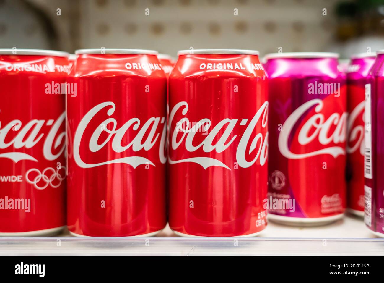 Cans of Coca-Cola drinks seen in a supermarket. (Photo by Alex Tai ...