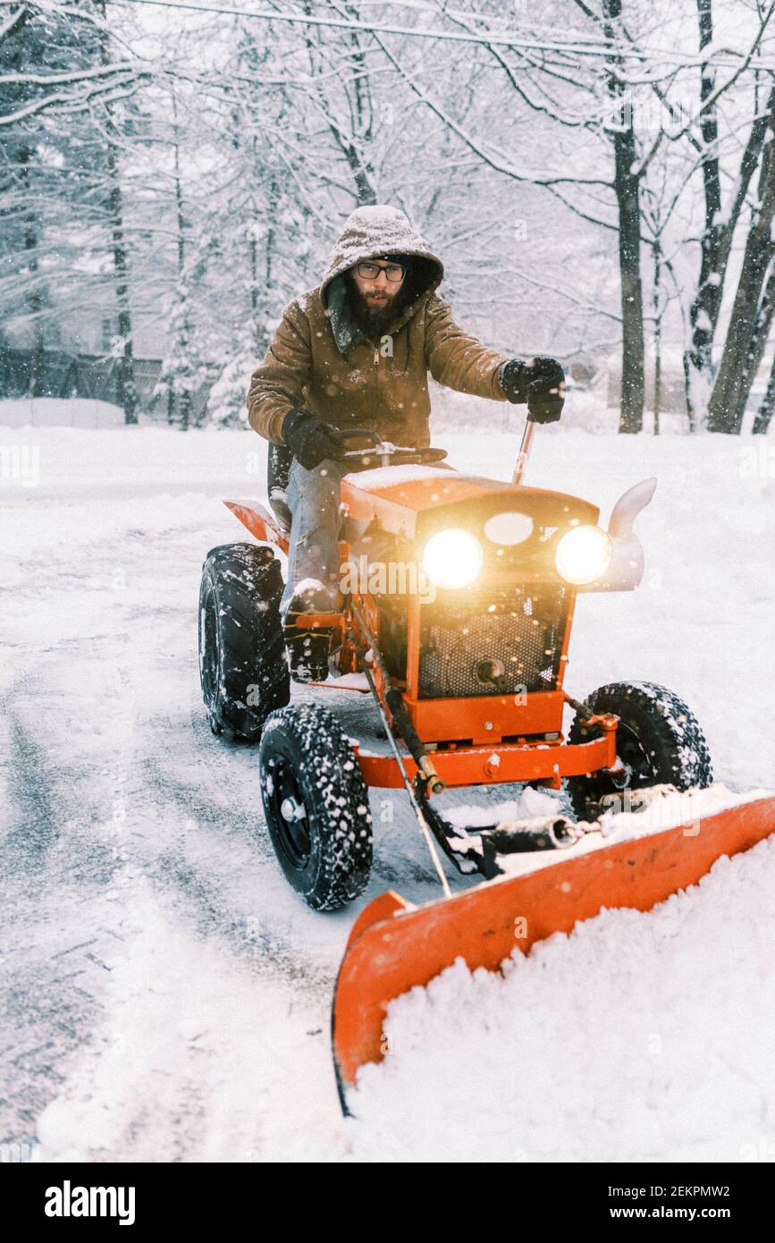 Tractor plowing snow hi-res stock photography and images - Alamy